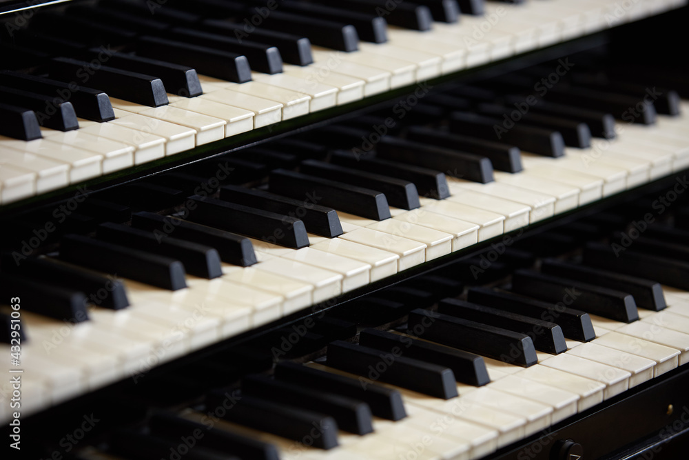Simple triple pipe organ instrument keyboard. Three organ keyboards ...