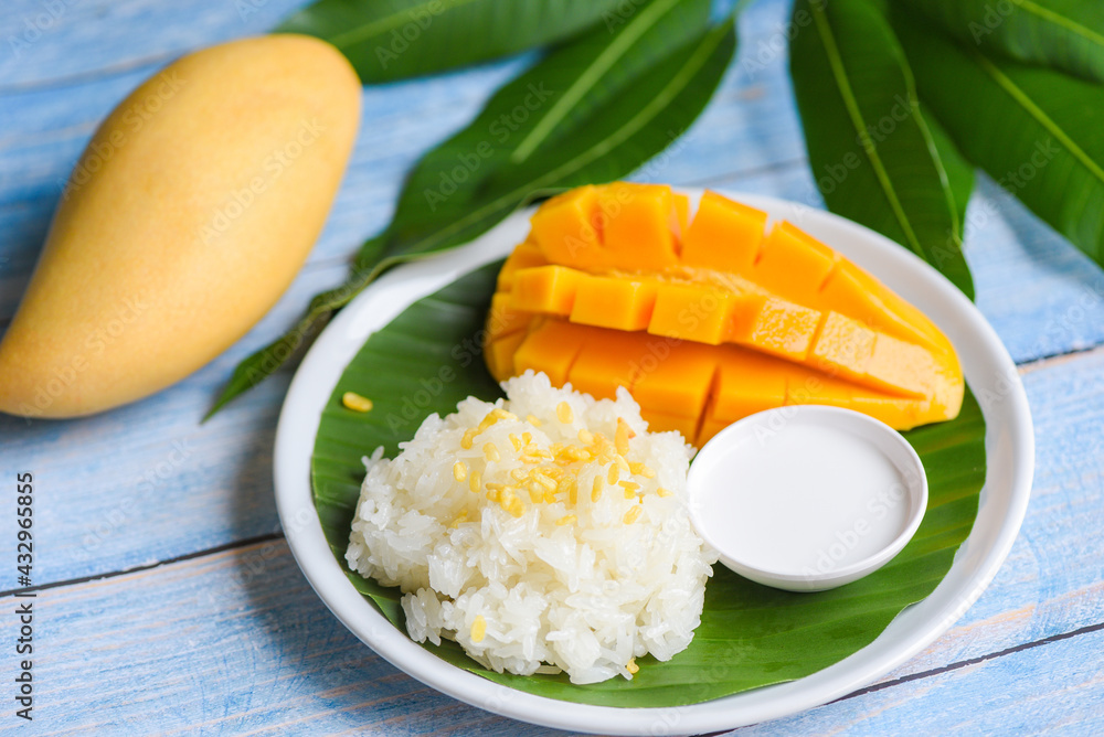 Ripe mango rice cooked with coconut milk, Asian Thai dessert tropical ...