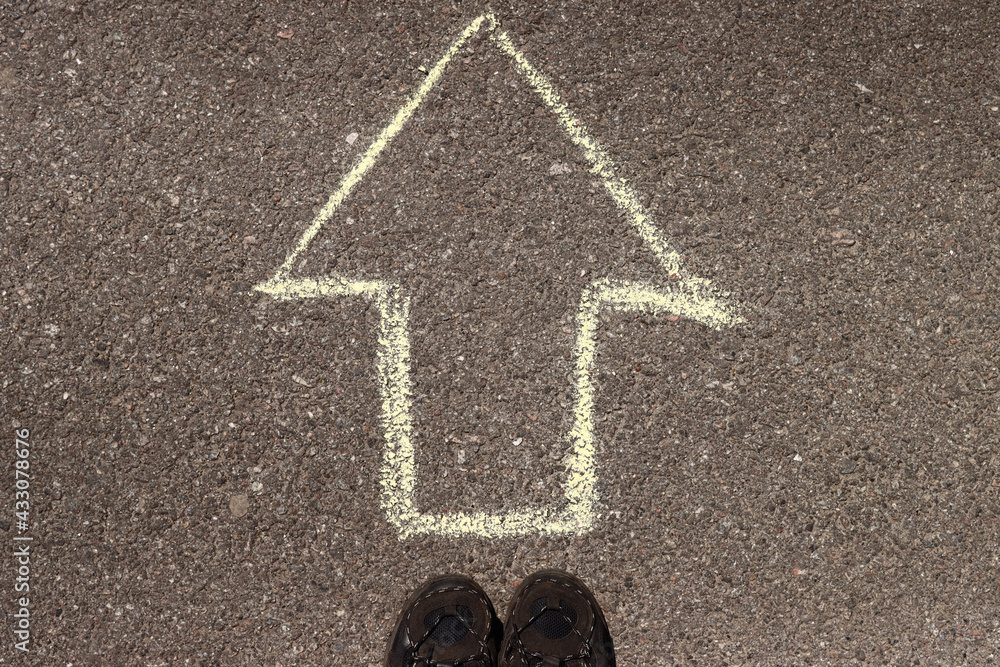 feet and drawing arrows on pavement asphalt Stock Photo | Adobe Stock