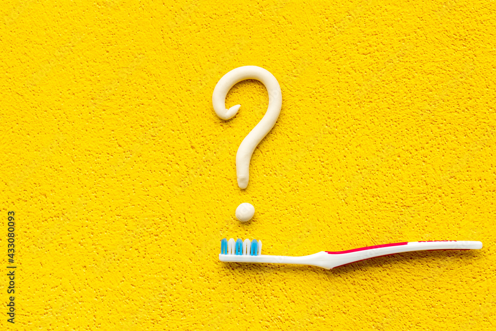 Question mark of toothpaste with toothbrush, top view. Oral care and ...