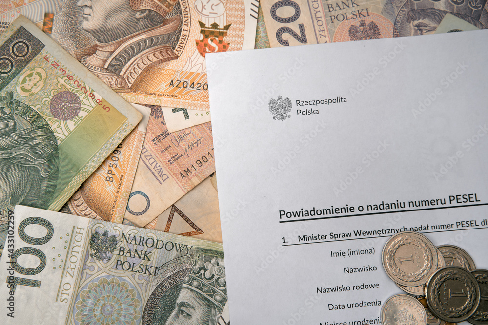 National identification number document in background of zloty and ...