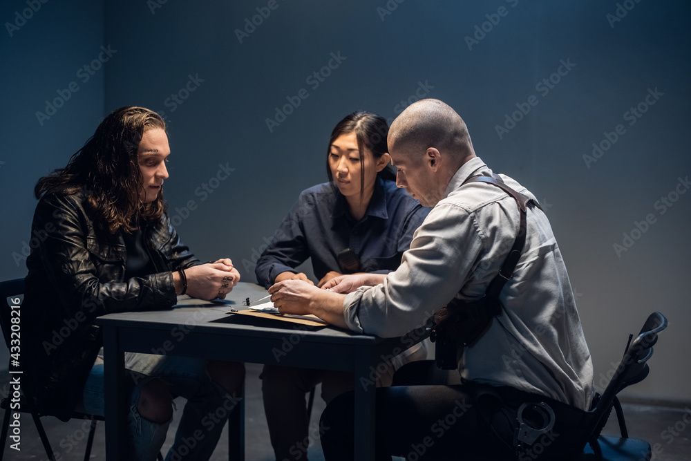 In the police station's interrogation room, good and bad cops are ...