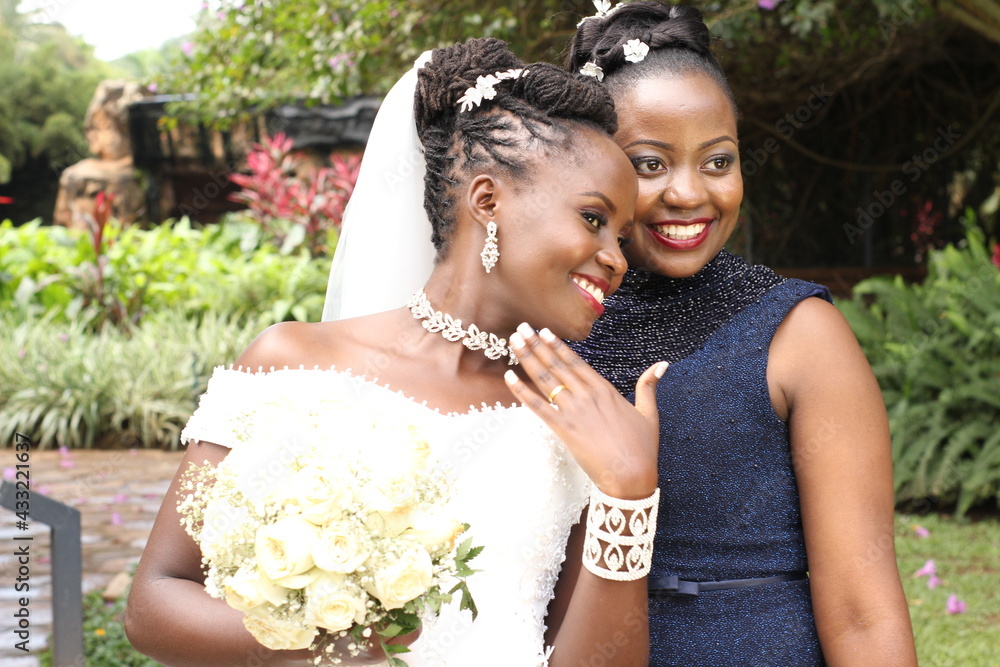 The bride one of her bride maids pose different ways, smiles and facial ...