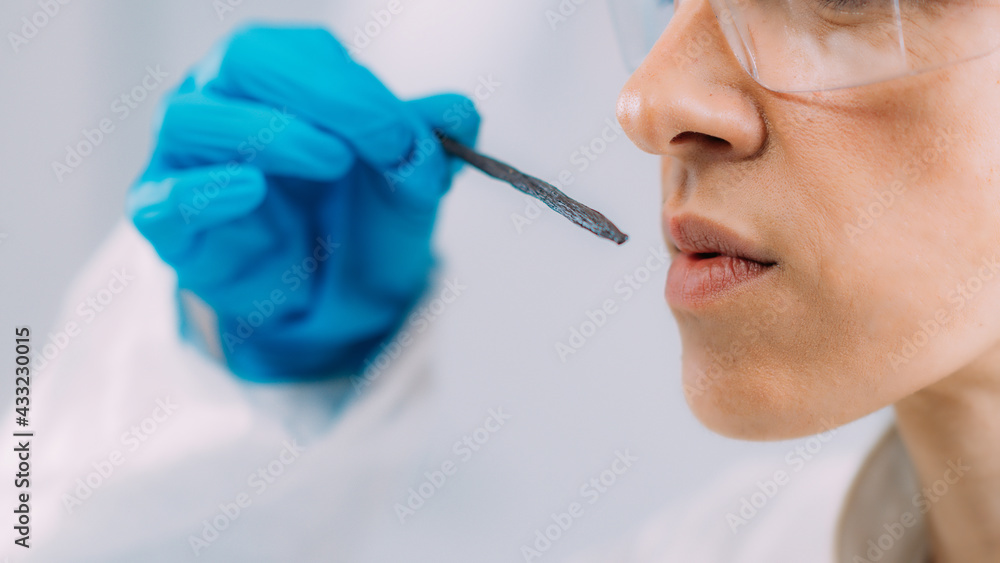 Olfaction Test. Female Scientist Examining Vanilla Smell. Stock Photo ...