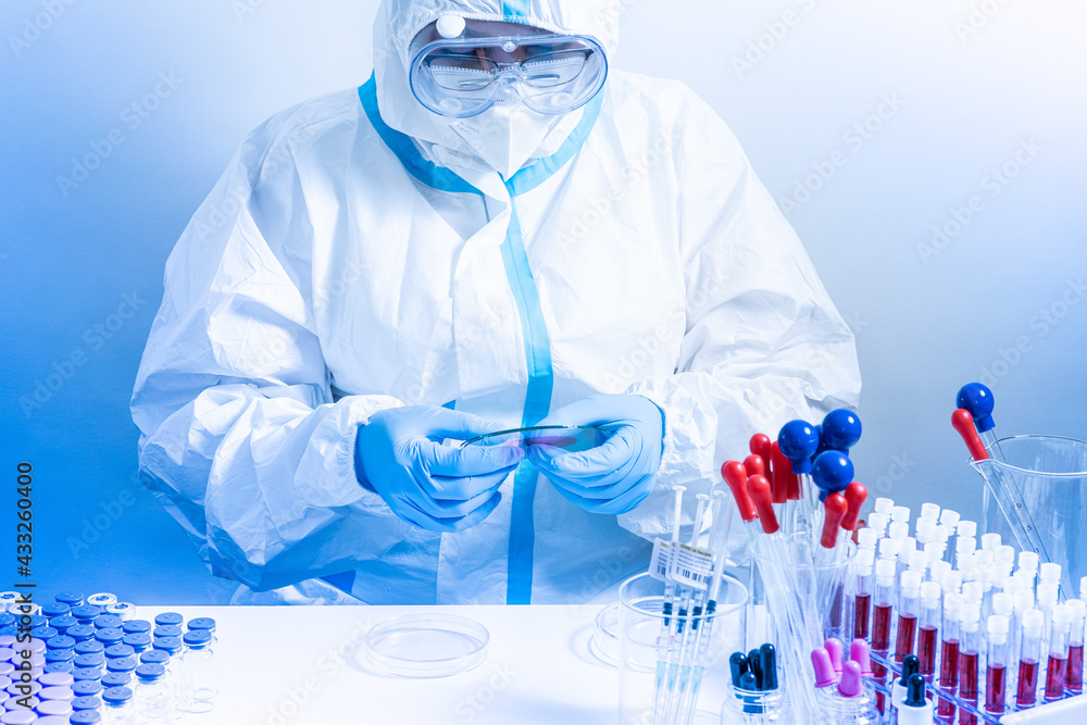 Medical laboratory with equipment and Microbiology scientist wearing ...