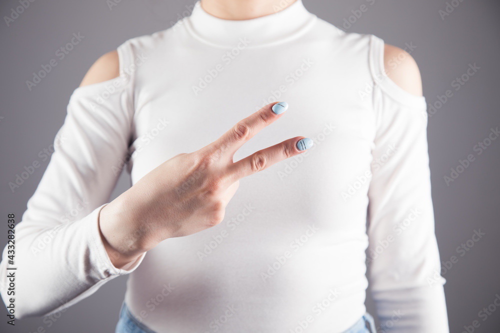 young girl shows a sign of peace Stock Photo | Adobe Stock
