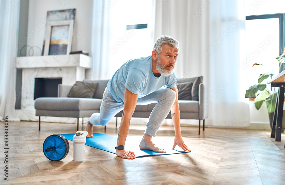 Sport, fitness and healthy lifestyle concept. Mature man doing ...