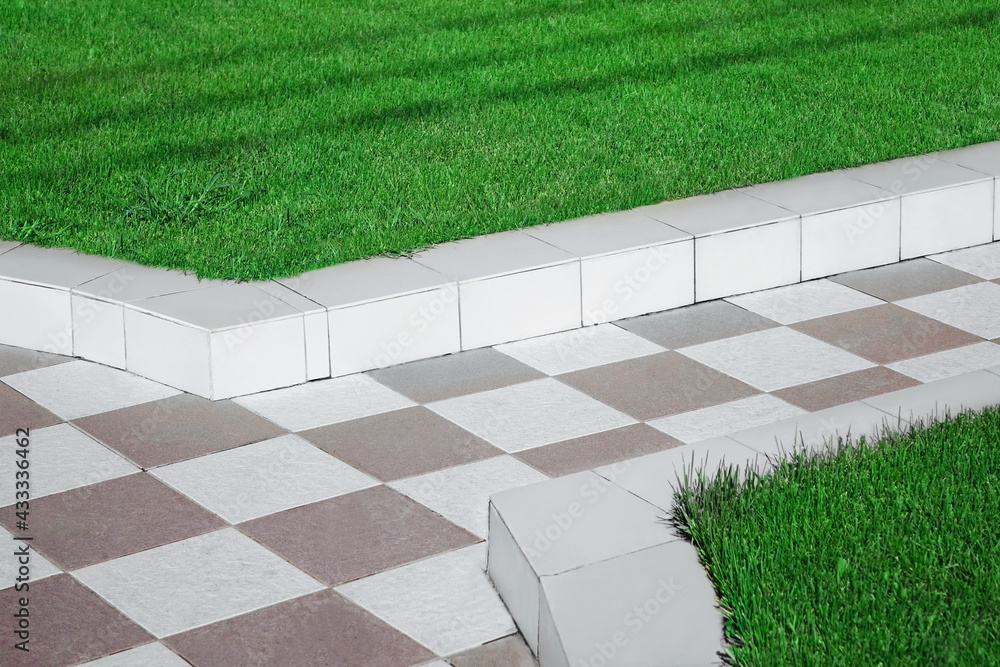 Tiled Footpath from Ceramic Tiles and Boarders Between Walkway and ...