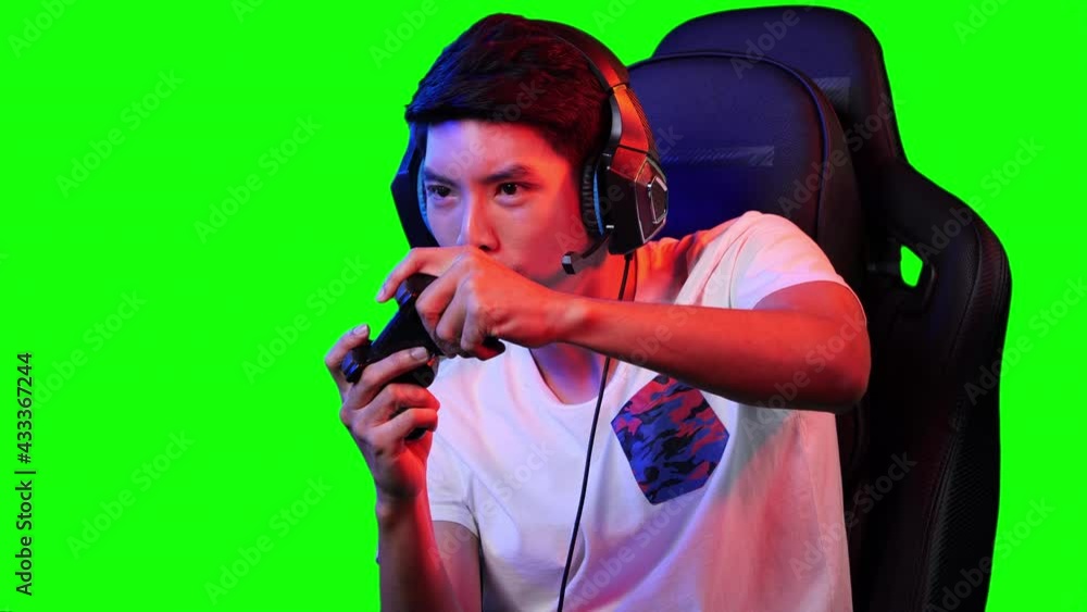 Vidéo Stock Asian gamer man playing game and looking at screen. Asian ...