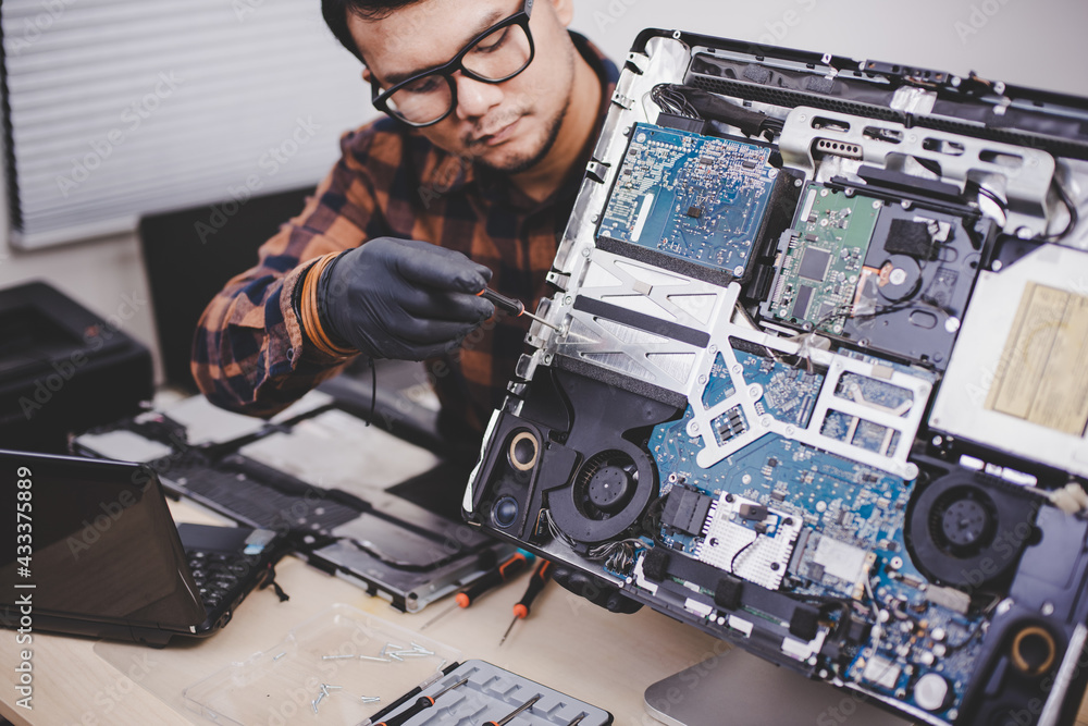repairing the broken computer Stock Photo | Adobe Stock