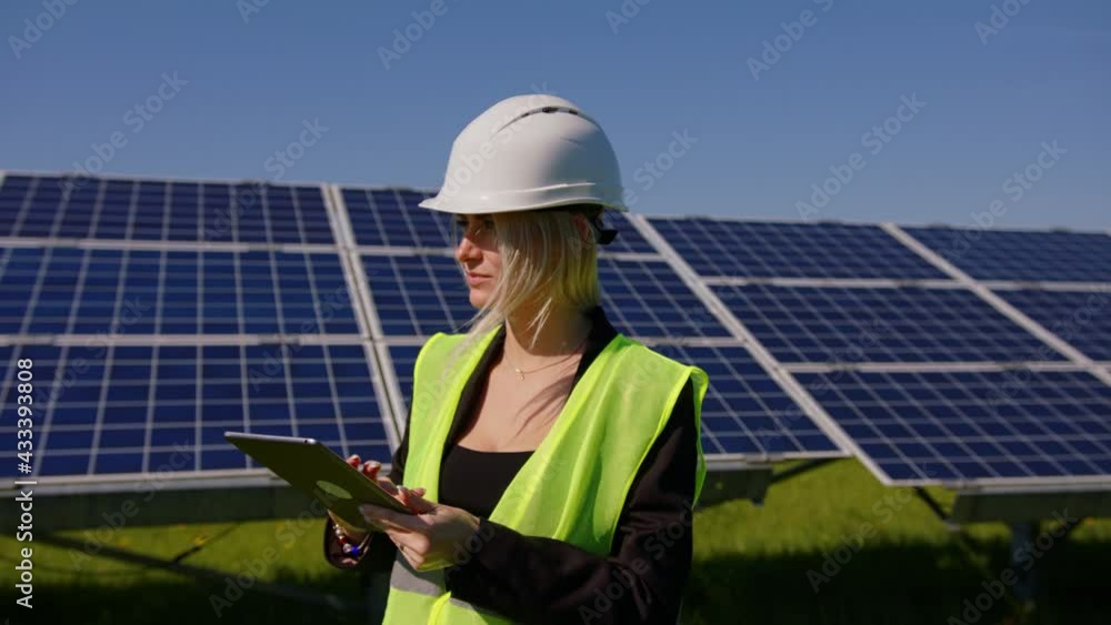 Female ecological engineer uses digital tablet and collects efficient ...