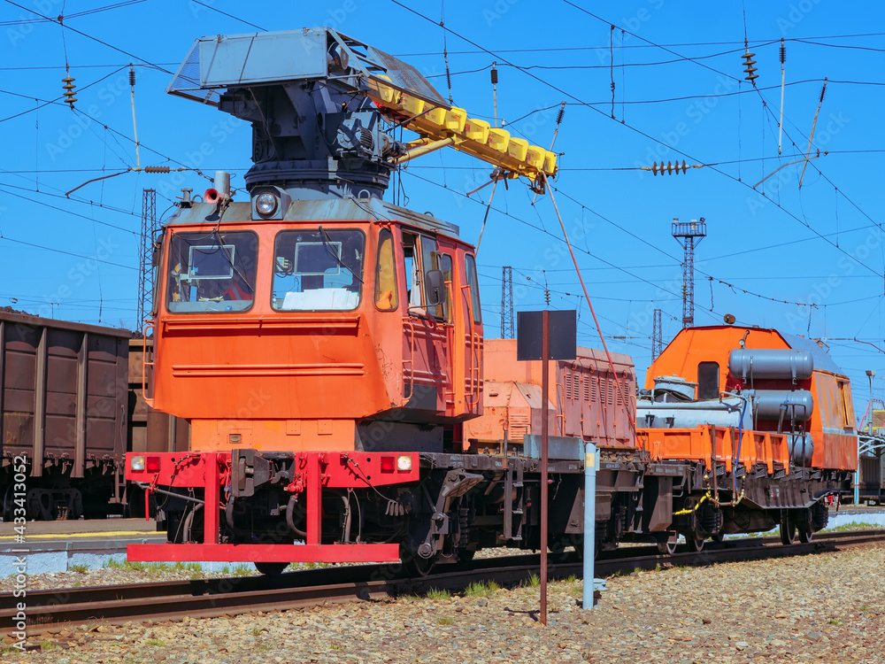 Railway crane. Loading locomotive with the diesel engines. Small diesel ...