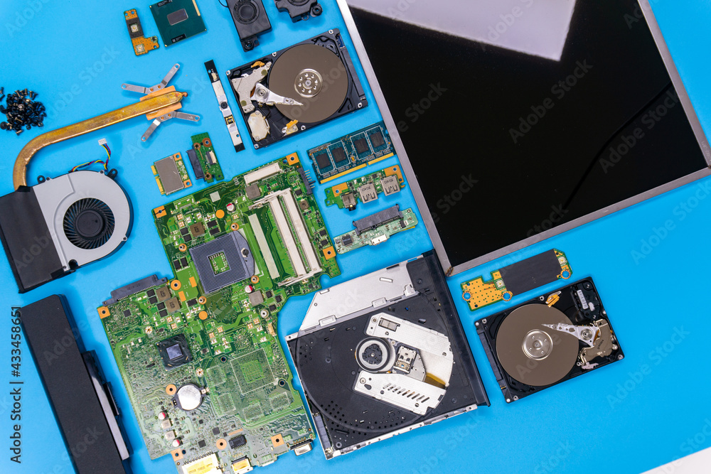 Parts of a modern computer. The insides of a laptop on a blue ...