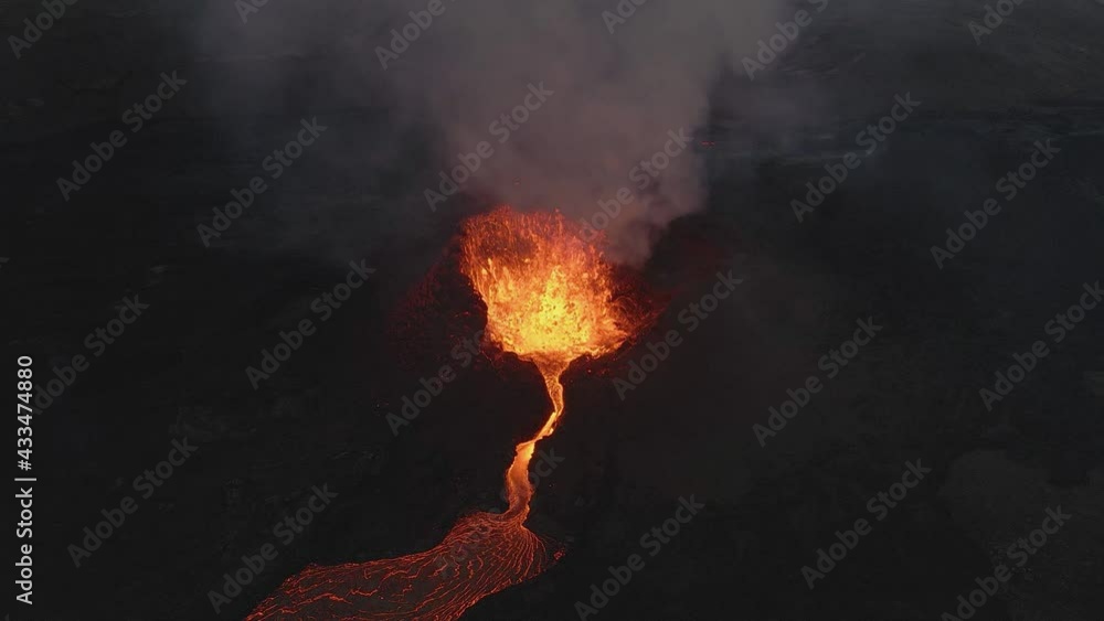 Fountain of magma and lapilli erupting from volcano crater ...