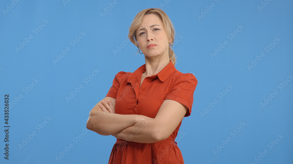Young Angry and furious woman posing with hands crossed isolated over ...