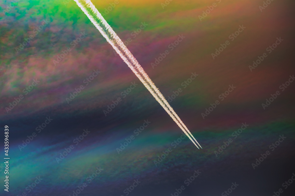 A rare sight: iridescent clouds with a plane. Diffraction can make ...