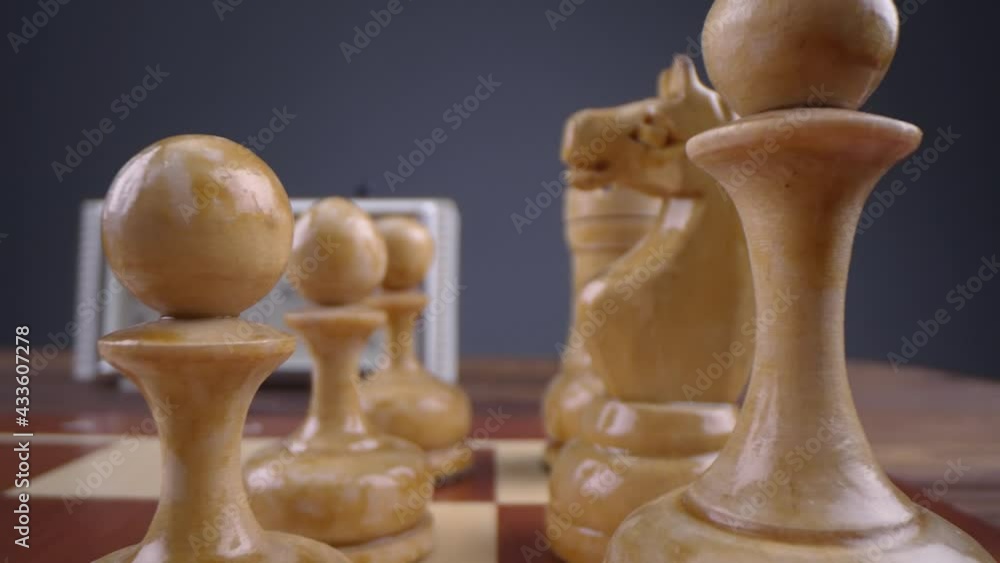 Look between the chess pieces. Two chess players man and woman play ...