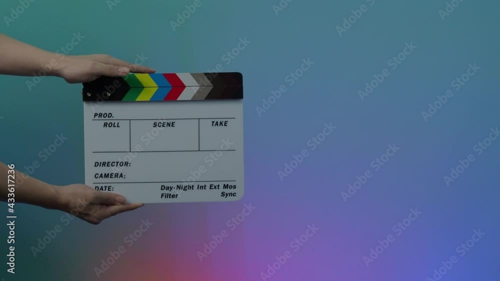 Movie Clapperboard. Man hand hold and move up film slate in to the ...
