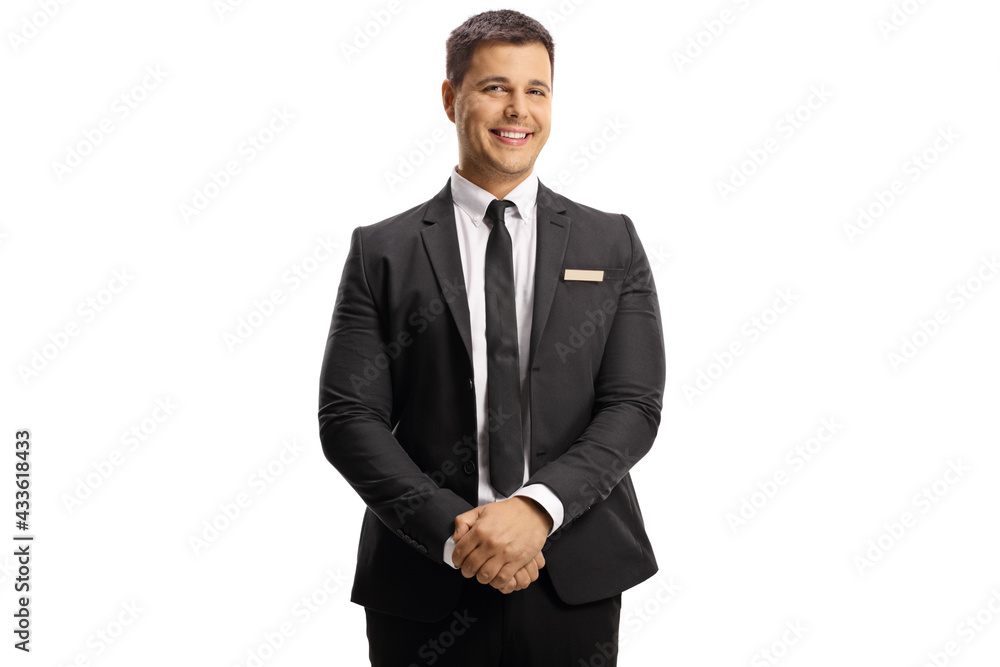 Young elegant man with a name tag on his suit smiling at camera Stock ...