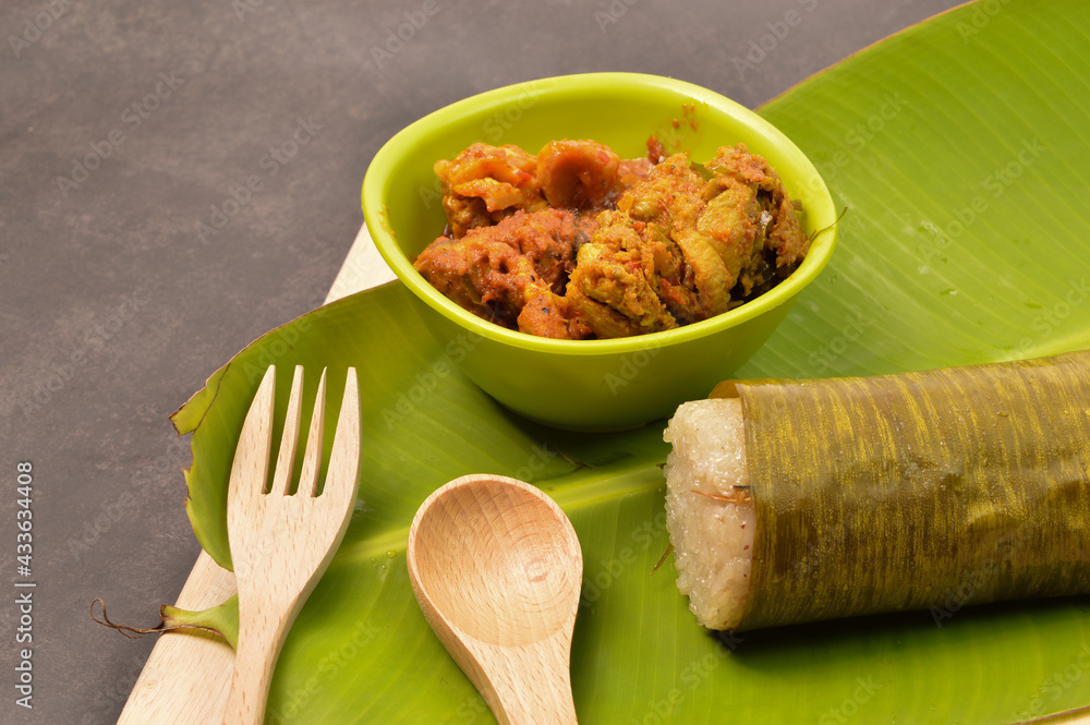 Malaysian traditional food called as LEMANG and chicken rendang ...