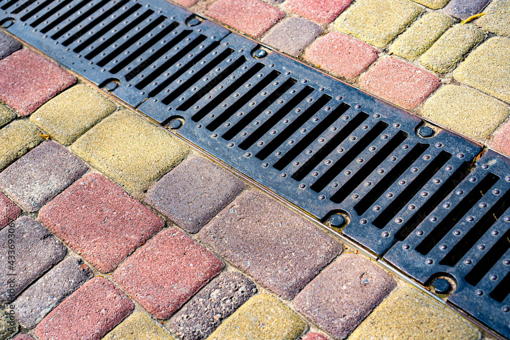 Stormwater cast iron drainage system in a pavement. Is used for ...