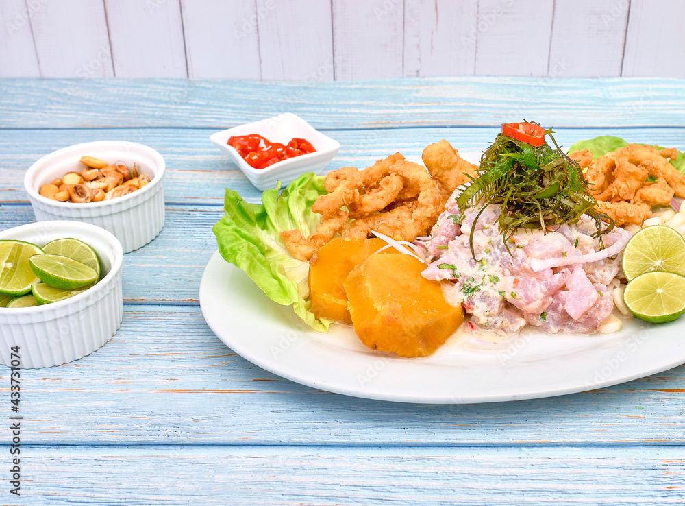 Peruvian food: fish ceviche and chicharron de pescado with fried ...