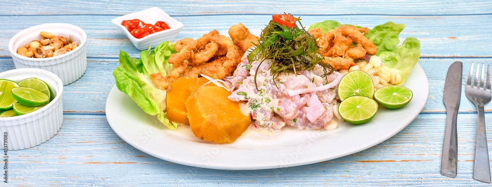 Peruvian food: fish ceviche and chicharron de pescado with fried ...