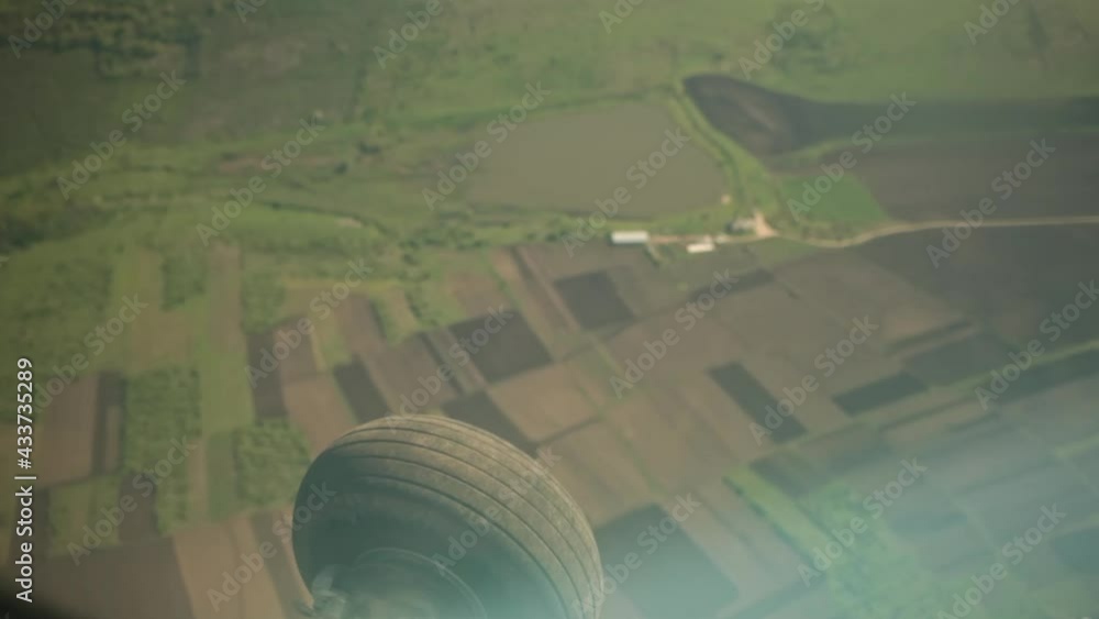 Vídeo do Stock: View from the plane window. Flying over fields ...