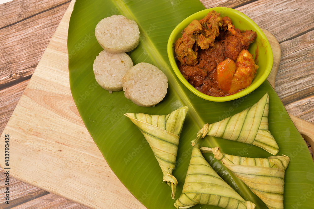Malay traditional food called as Lemang and Ketupat rice with chicken ...