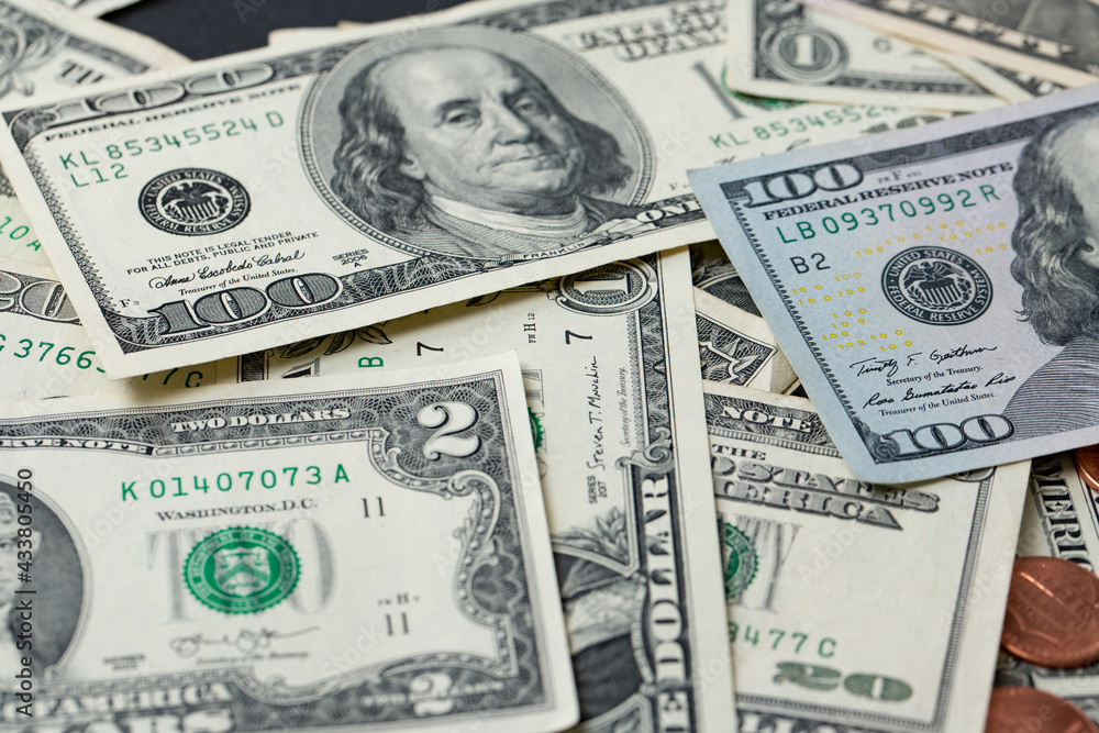 Dollar banknotes spread out. One dollar to one hundred dollar banknotes ...