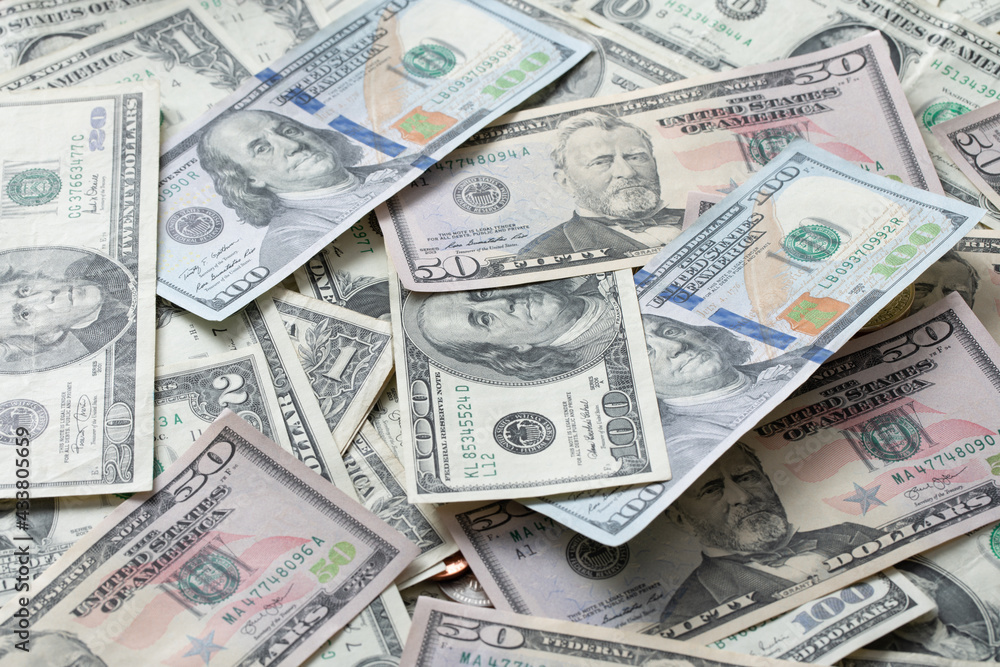 Dollar banknotes spread out. One dollar to one hundred dollar banknotes ...