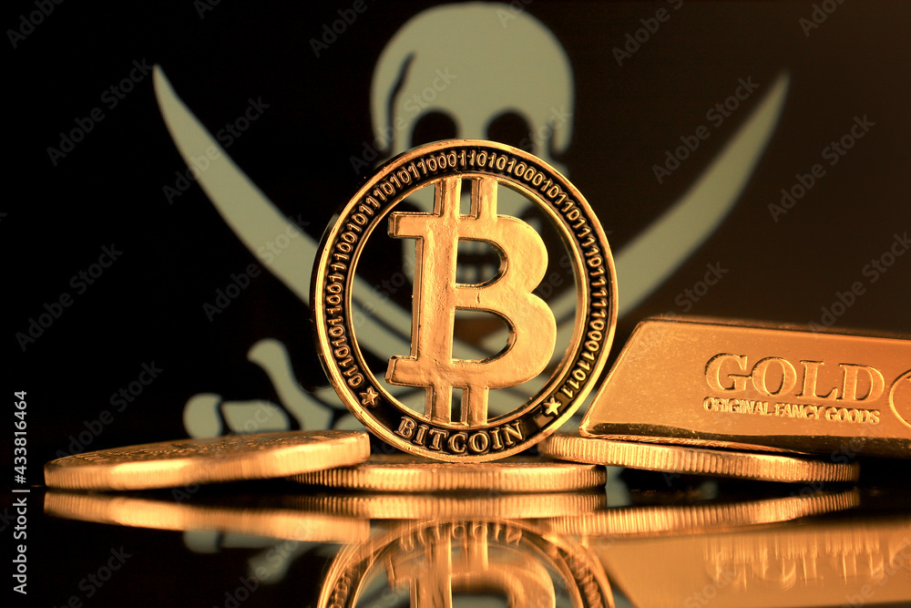 Physical version of Bitcoin, gold bar and Pirate Flag. Conceptual image ...