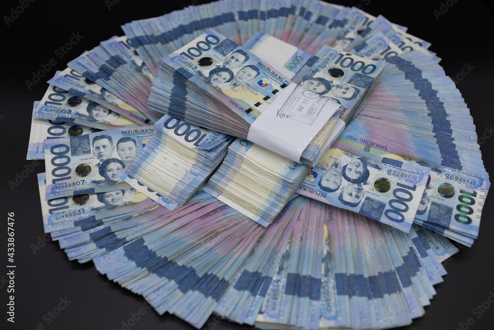 A pile of one thousand Philippines peso banknotes. Cash of Thousand ...