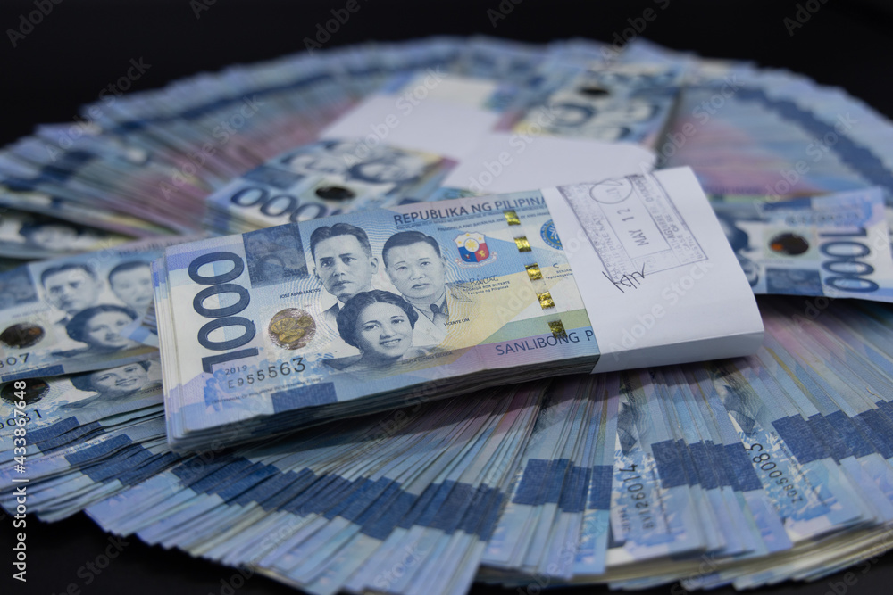 A pile of one thousand Philippines peso banknotes. Cash of Thousand ...