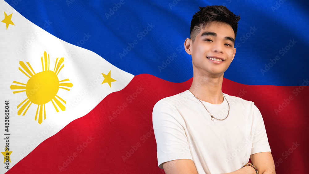 A proud and patriotic young Filipino male, in front of a waving ...