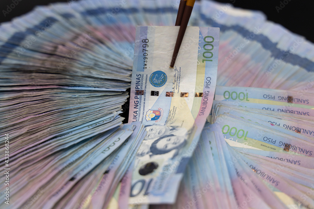 A pile of one thousand Philippines peso banknotes. Cash of Thousand ...