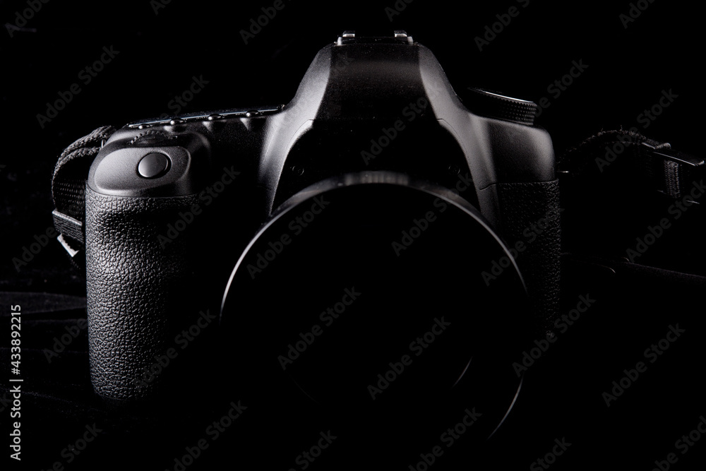 Professional modern DSLR camera low key image - Modern DSLR camera with ...