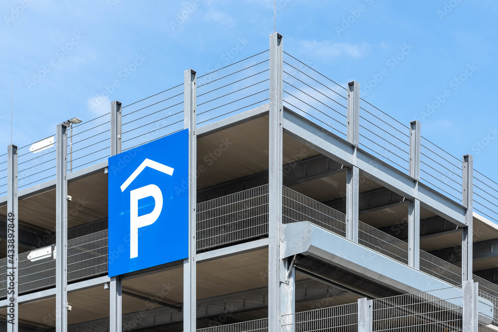parking sign on a building, steel construction of a parking garage ...