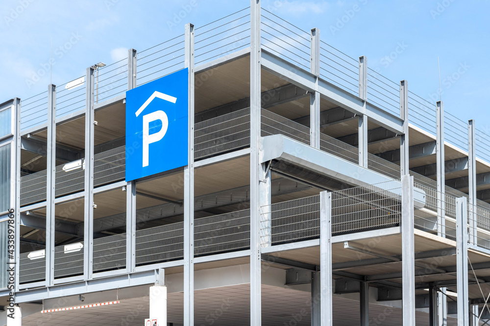 parking sign on a building, steel construction of a parking garage ...