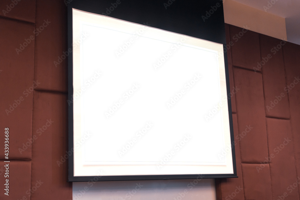 Seminar room with blank projector empty white screen for presentation ...