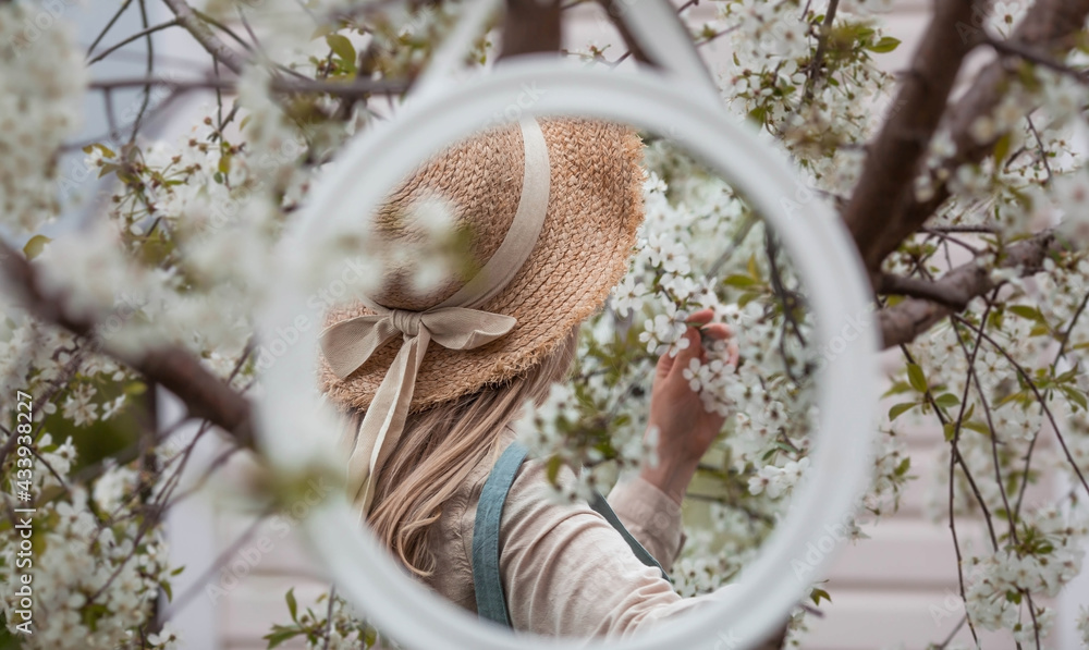 Foto de Vintage. Reflection in the mirror. A beautiful, young woman in ...