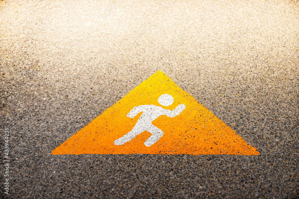 Runner symbol A running track in the park The white runner symbol is ...