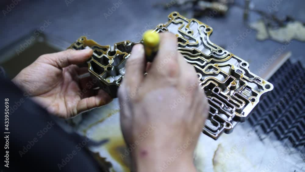 repair of the valve body of an automatic transmission Stock ビデオ | Adobe ...