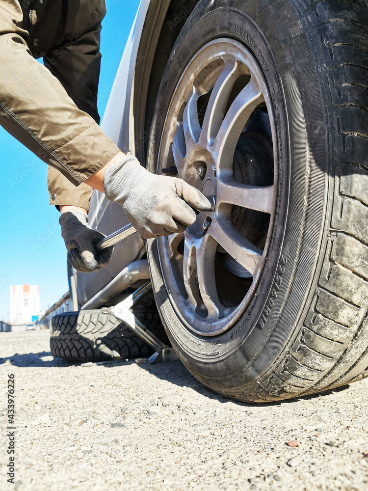 Replacing a wheel on a car yourself, wheel breakage Stock Photo | Adobe ...