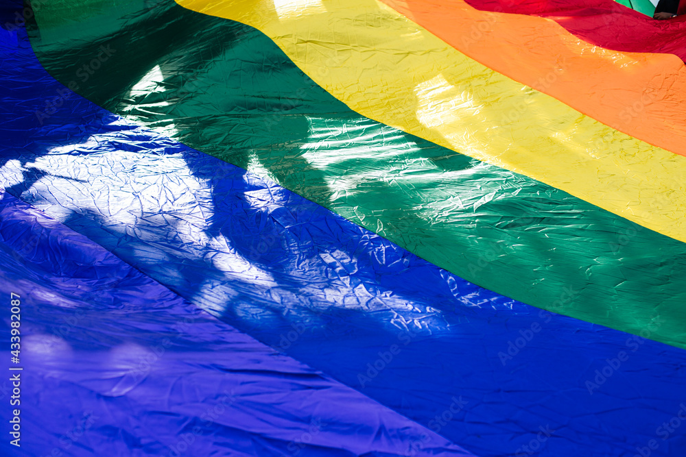 Shadow of pride parade-goers on the rainbow flag at the Metro Manila ...