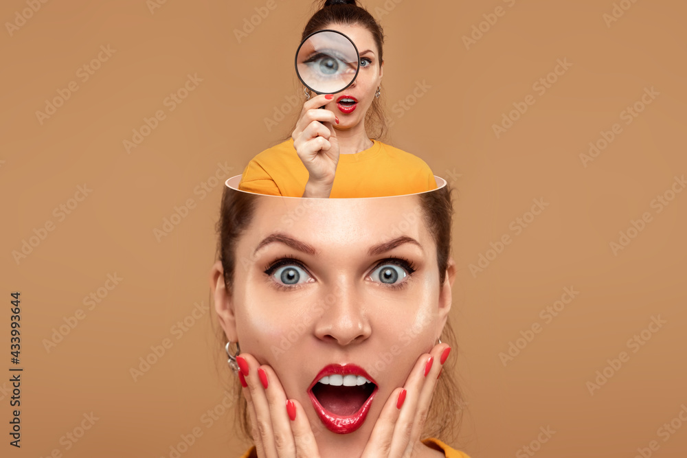 In the head of a beautiful girl, the brain stands with a magnifier ...