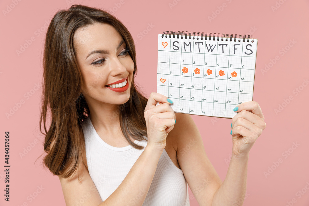Close up happy young woman in white clothes hold female periods ...