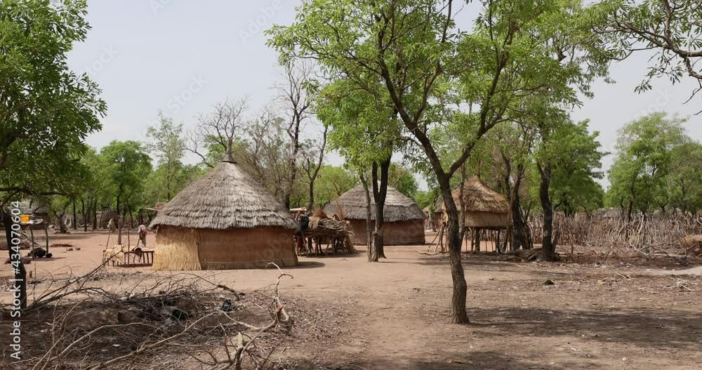 North Ghana village mud grass huts Africa 4K. Rural traditional mud and ...