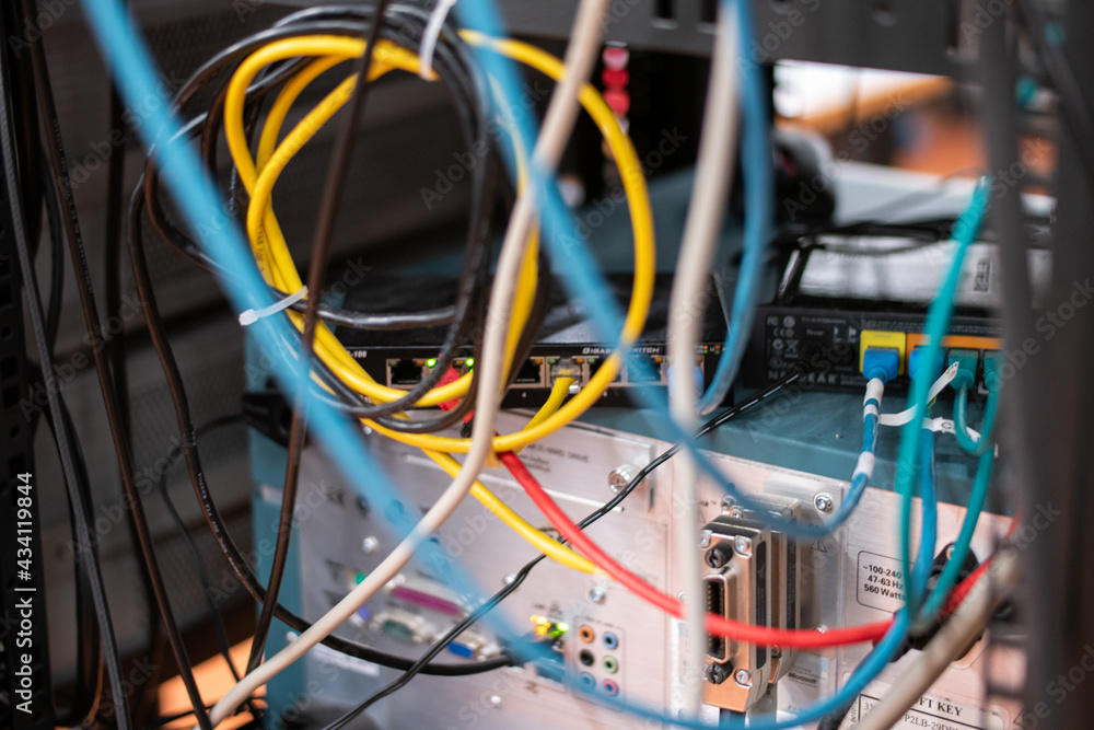 Messy connection computer and LAN cables power cord plugs. close up ...