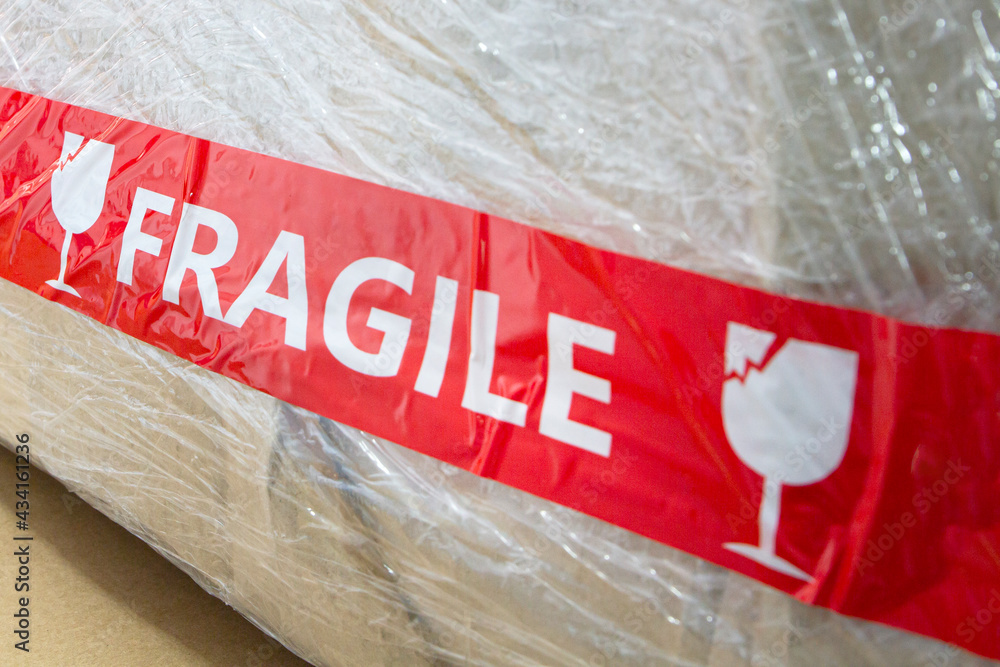 careful package for sending with fragile sticker warning Stock Photo ...